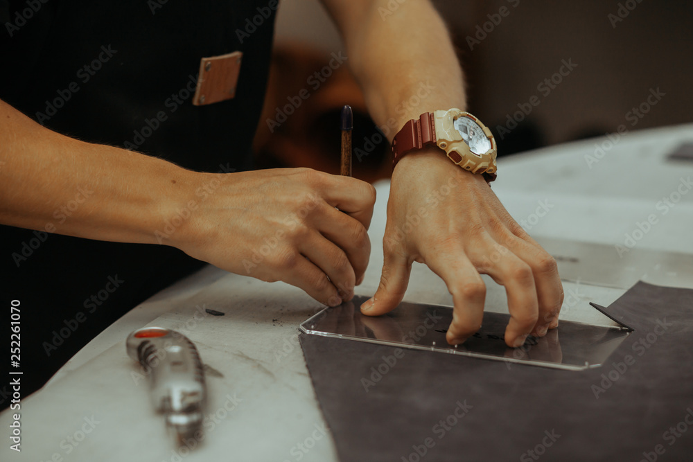 Man holding crafting tool and working. Close up of a master working ...