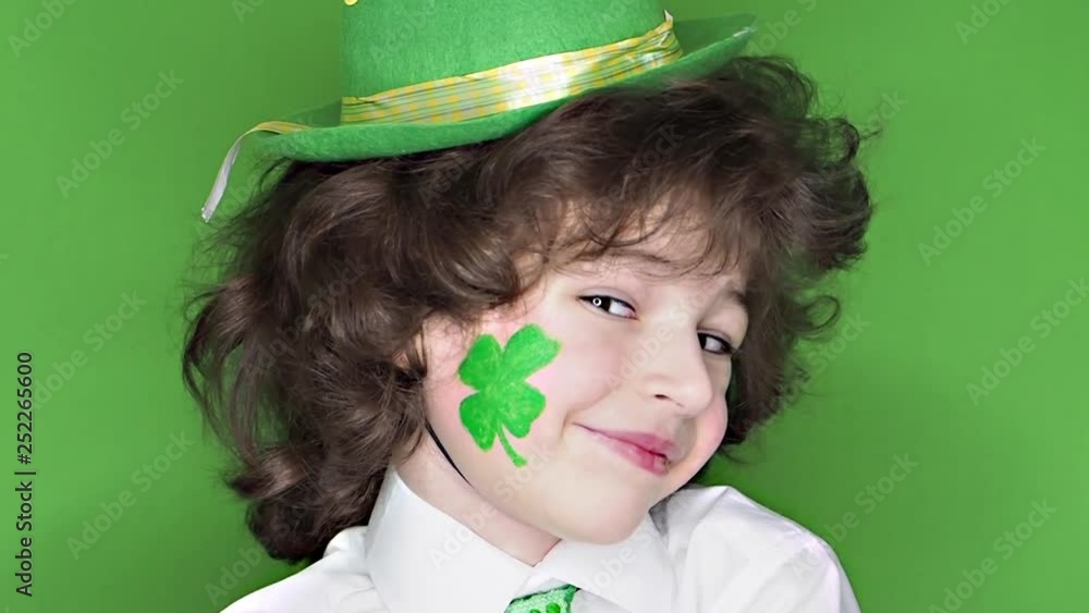 Child Celebrating St. Patrick's Day Showing his Make-up. A small, curvy ...