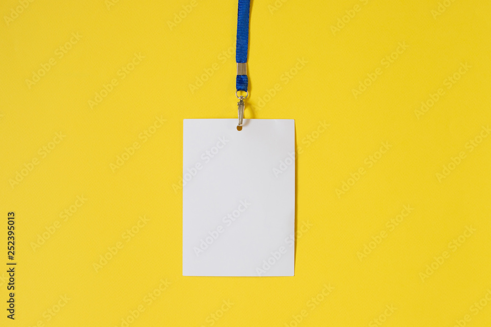Empty ID card badge icon with blue belt, on yellow background. Space ...
