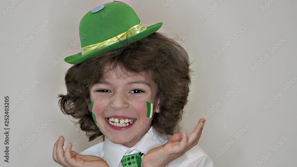 Child Celebrating St. Patrick's Day Laughing and Looking at Camera. A ...