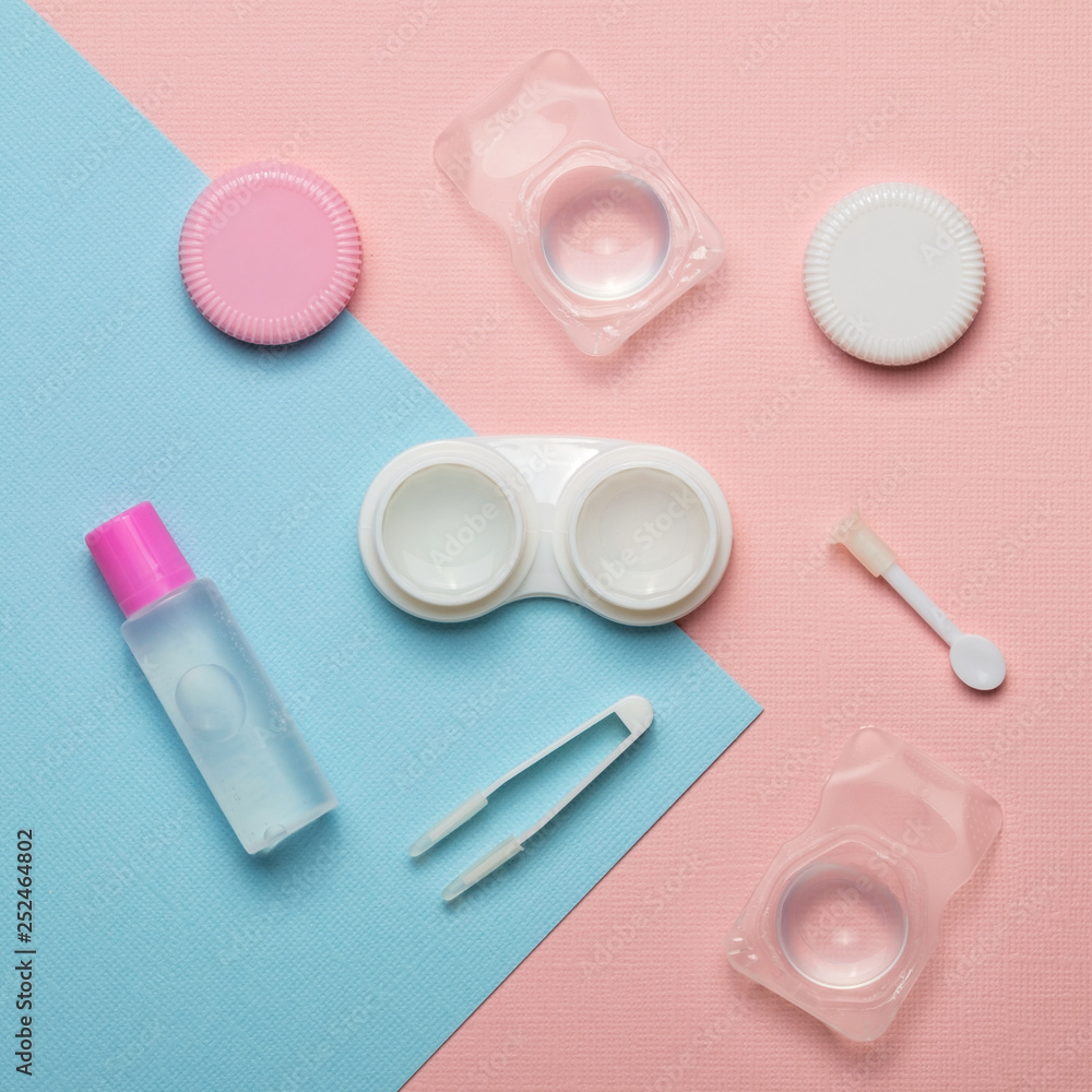 Accessories for contact lenses on a multicolored background. The view ...