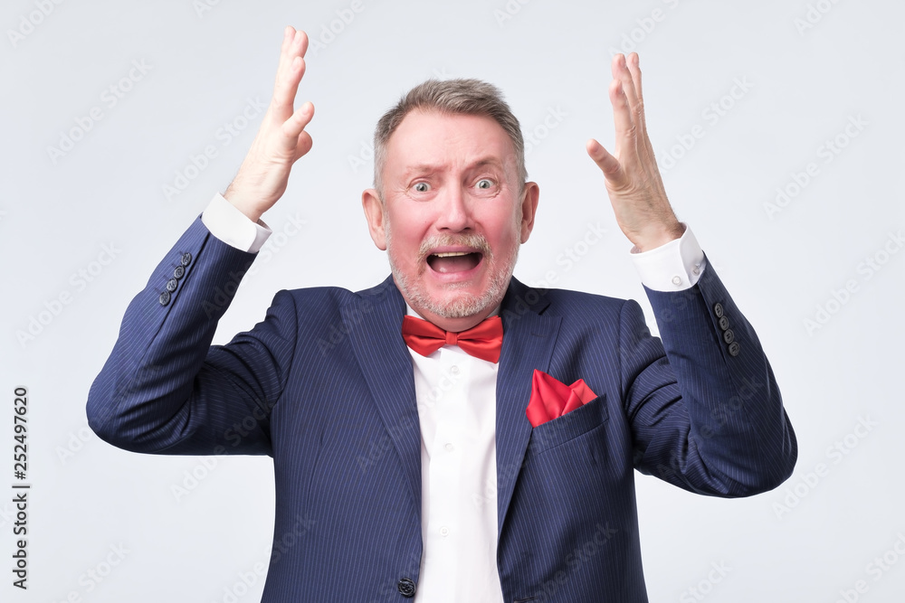 Oh no concept. Surprised, shocked man in blue suit holding hands up ...