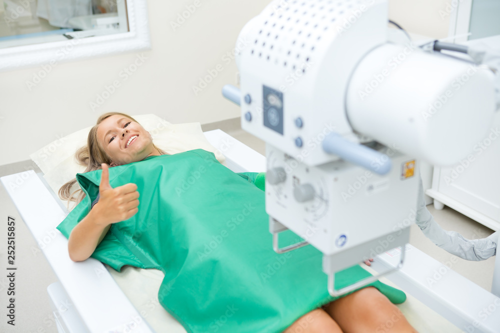 Doctor performing x-ray scanning for patient Stock Photo | Adobe Stock