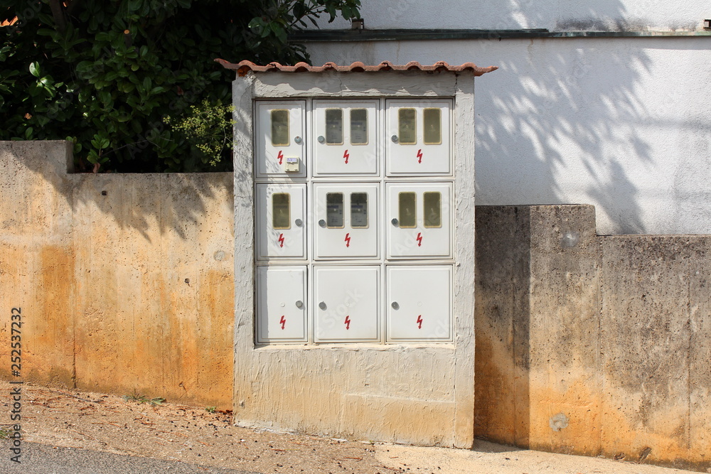 Multiple electrical meter boxes and safety switches inside visible ...