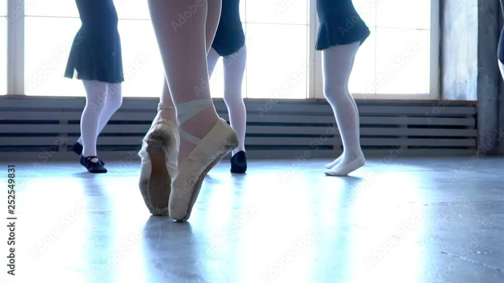 Girl dancer in ballet school learns to dance. Little Ballerina in ...