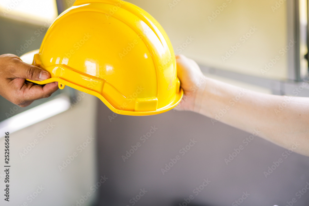 view of yellow safety helmet hat in the project at construction site ...