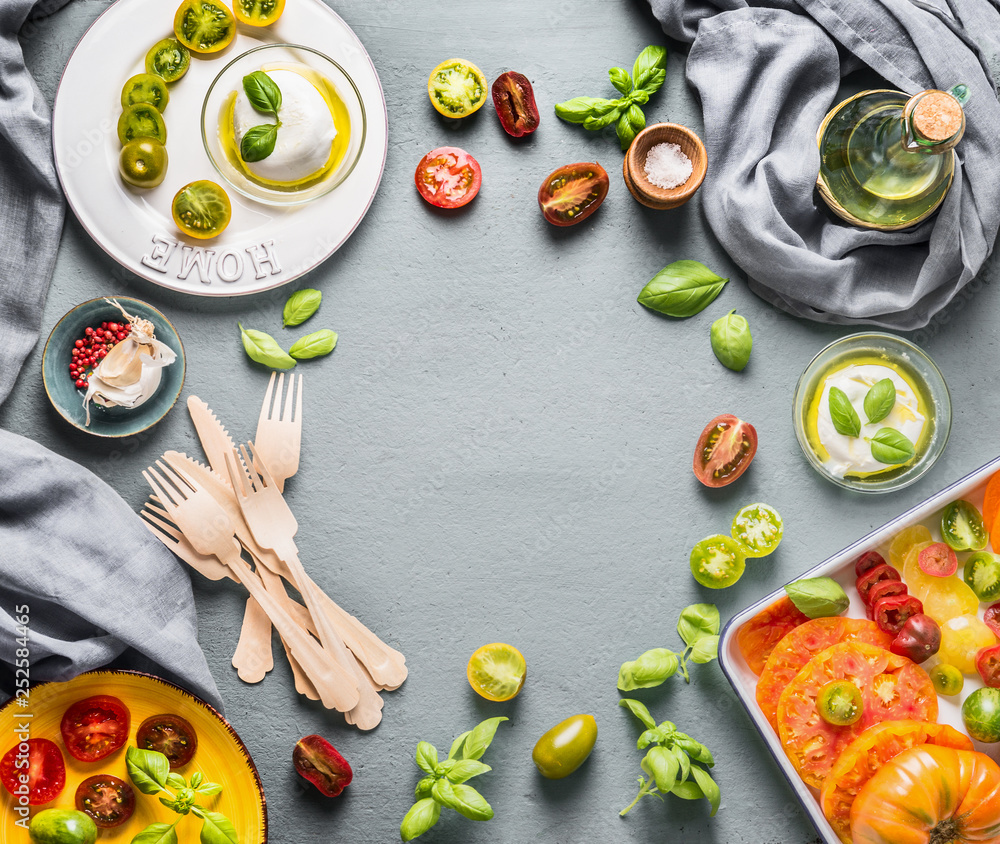 Food background with colorful tomatoes, mozzarella cheese with olives ...