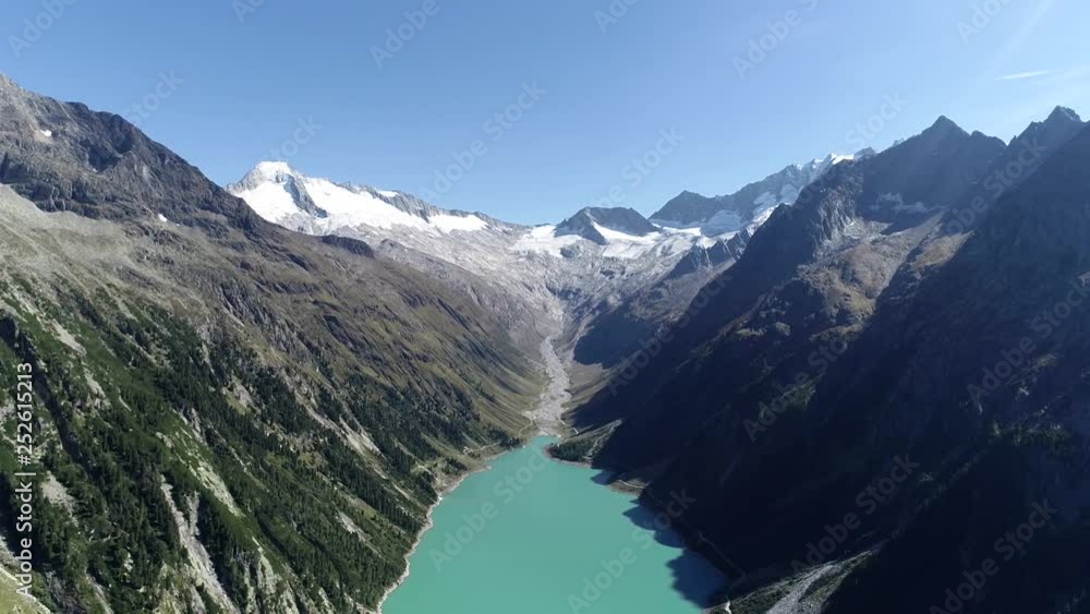 Aerial view of Alps looking at mountain range border of Austria and ...