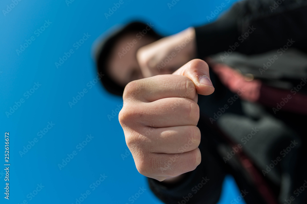 Unidentifiable teenage boy attacking with hes bare hands, focus on the ...