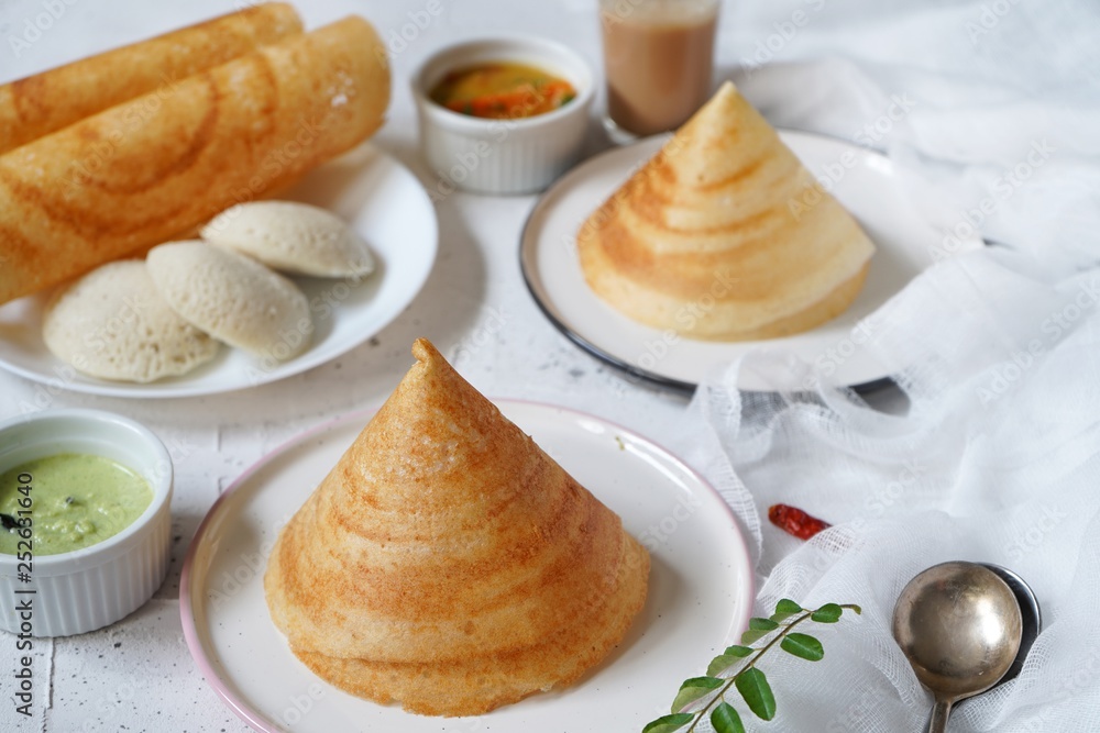 South Indian breakfast cone shaped dosa Idli sambar and chtney ...