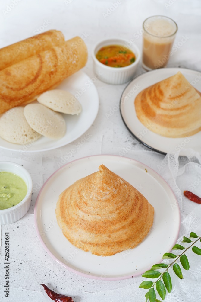 South Indian breakfast cone shaped dosa Idli sambar and chtney ...