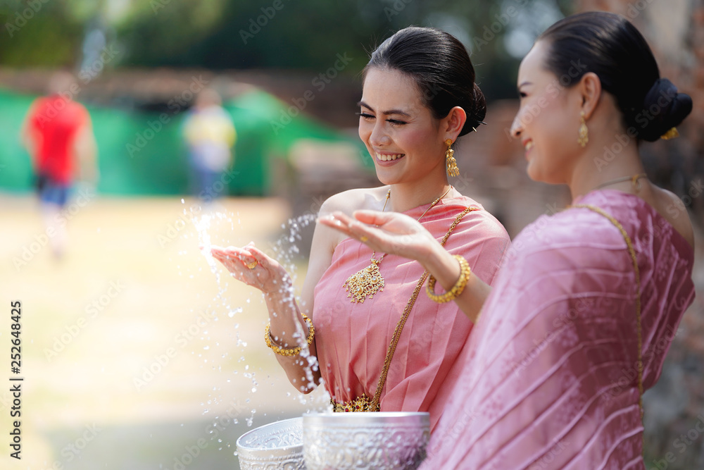 Songkran festival in Thailand. Happy Thai girls in Thailand cultural ...
