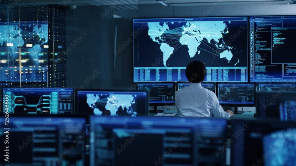 In the System Control Room Chief Operator Watches Screens With ...