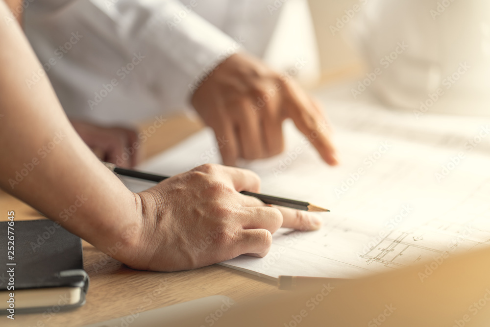 Architect & Engineer working drawing document about project planning ...