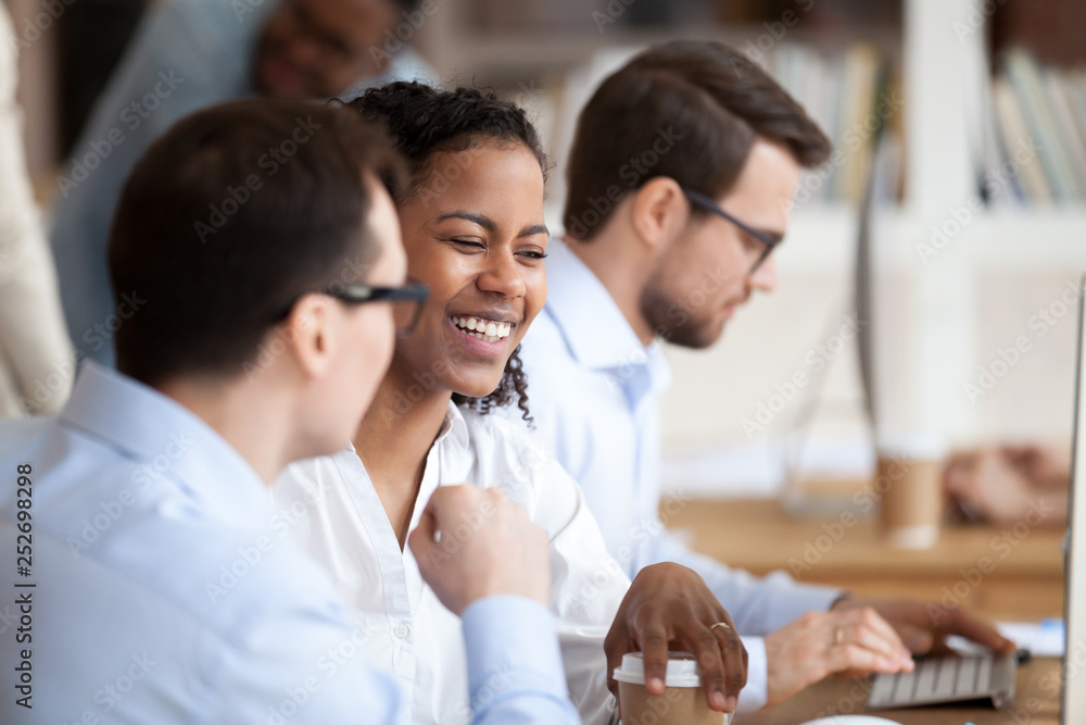 Positive colleagues talking during workday focus black female employee ...