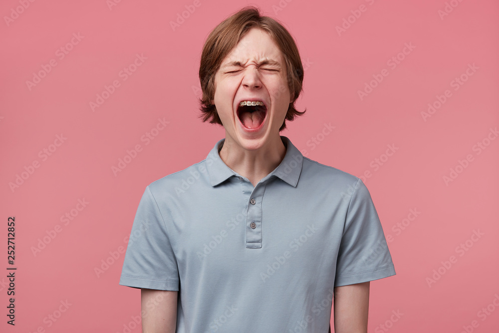 With young man happened something terrific, screams in pain, shouts ...