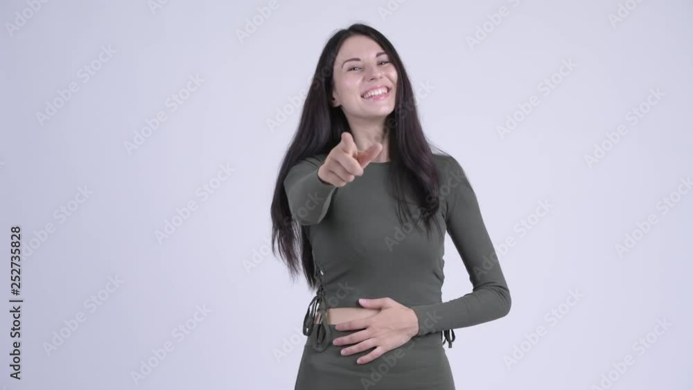 Happy young beautiful woman laughing and pointing at camera Stock Video ...