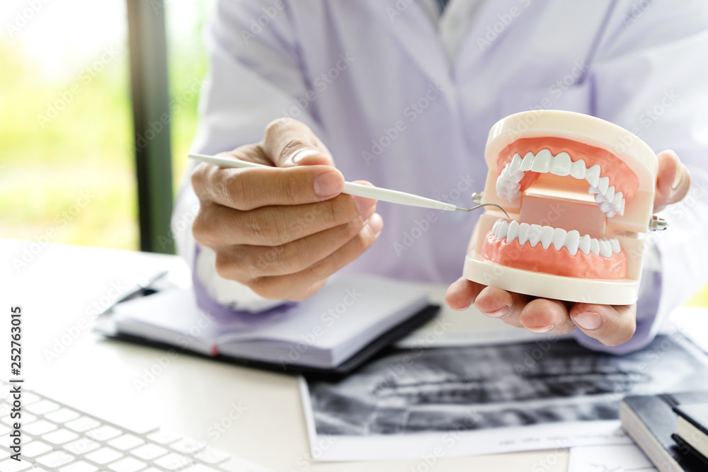dentist work on the table with Denture and teeth x-ray Stock Photo ...