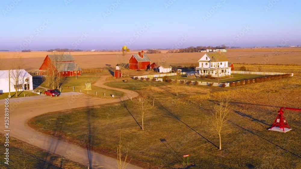 Vidéo Stock A drone aerial establishing shot over a classic farmhouse ...