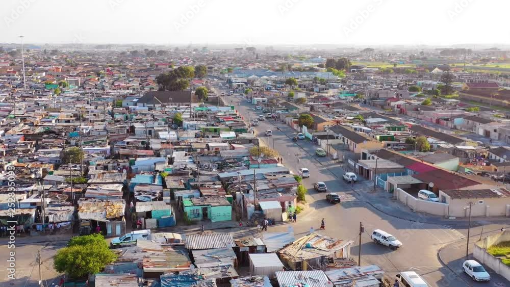Aerial over townships of South Africa, with poverty stricken slums ...