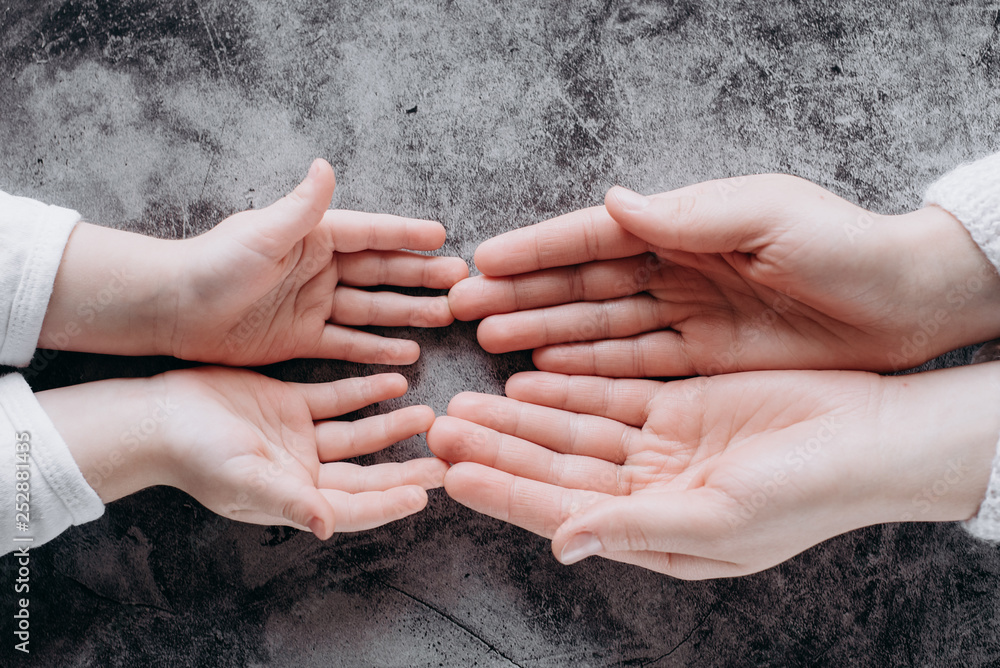 Close up view of family holding hands, loving caring mother supporting ...