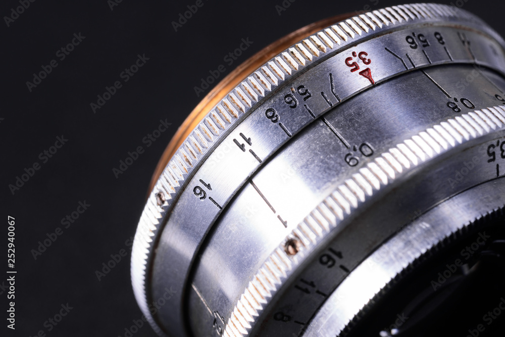Old vintage lens scales symbols closeup view. Photo with blurred gray ...