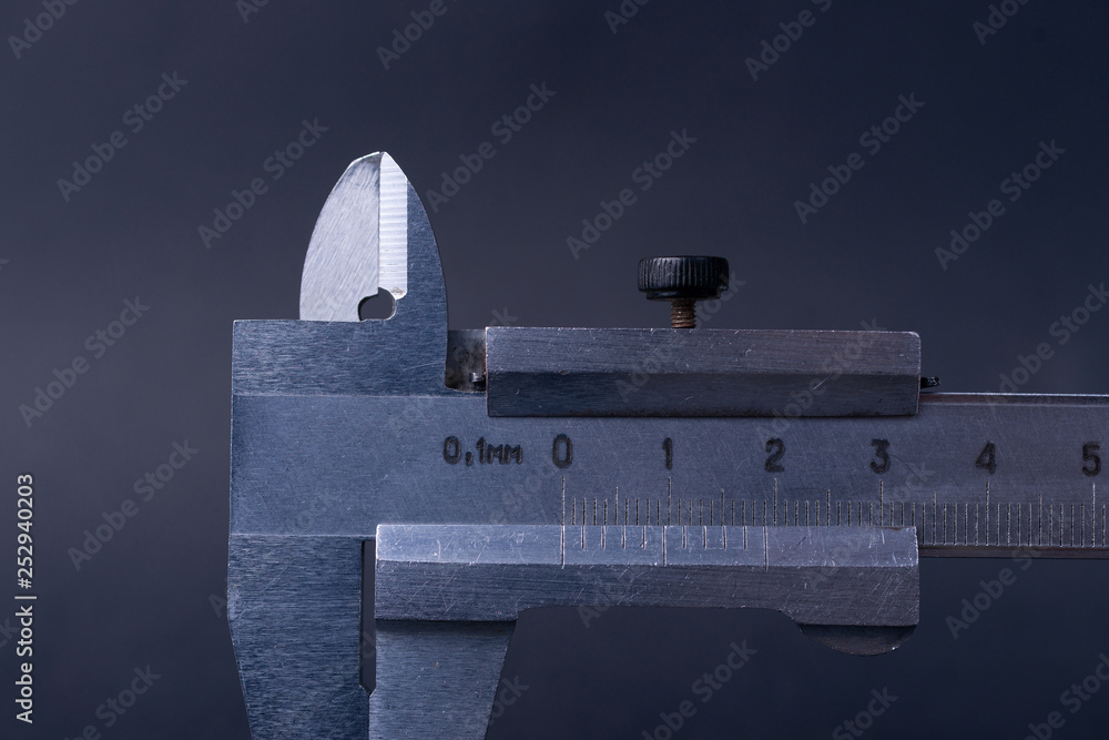 Vintage steel caliper tool closeup. Caliper tips and scale in focus ...