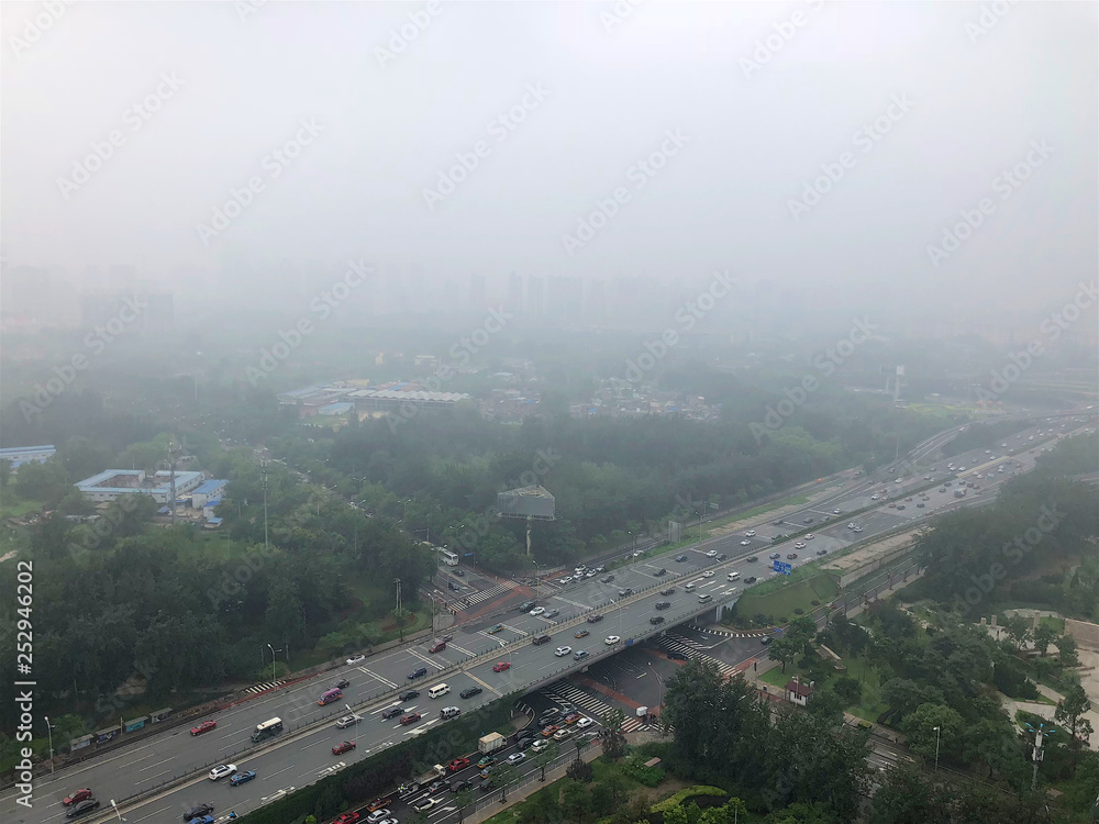 Top view highway with severe air pollution, fog and haze in Beijing ...