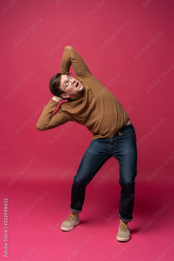 young cool man full body scared pose. Stock Photo | Adobe Stock