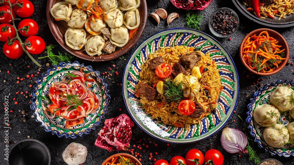 Traditional Uzbek oriental cuisine. Uzbek family table from different ...