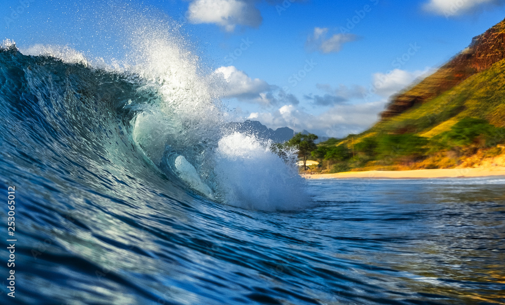 Powerful crystal clear ocean wave breaks on shore. West Coast of Oahu ...