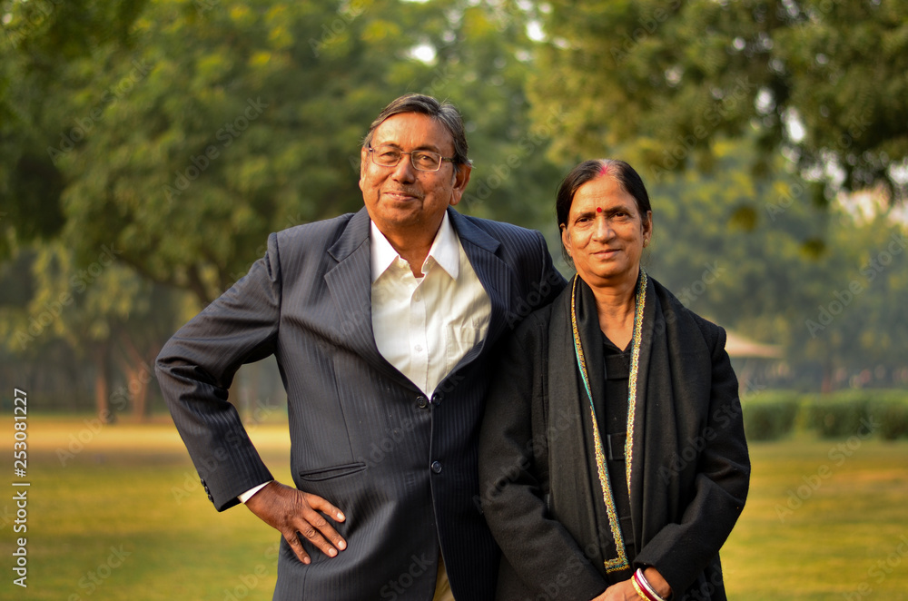 Happy looking retired senior Indian man and woman couple smiling and ...