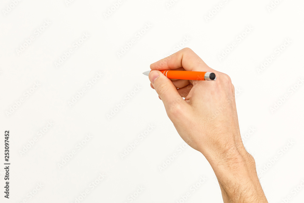 writing hand. male hand hold black pen write on the wall isolated on ...