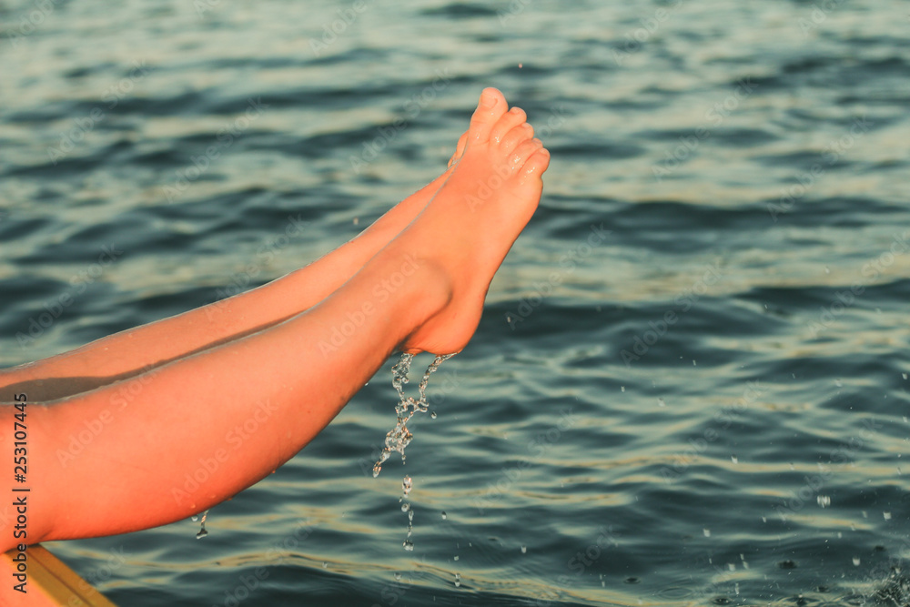 Woman's feet in a swimming pool under water jets Stock Photo | Adobe Stock