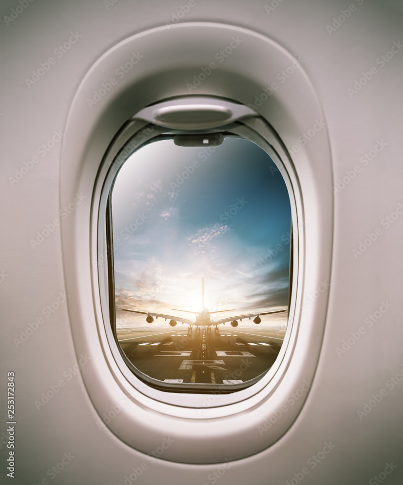 Airplane window view to runway with huge airplane Stock Photo | Adobe Stock