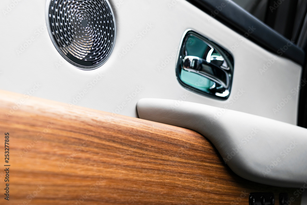 Door handle with power window control buttons of a luxury passenger car ...