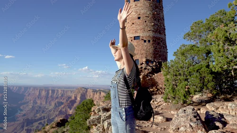 happy girl backpacker carefree stretch arms hugging amazing nature view ...