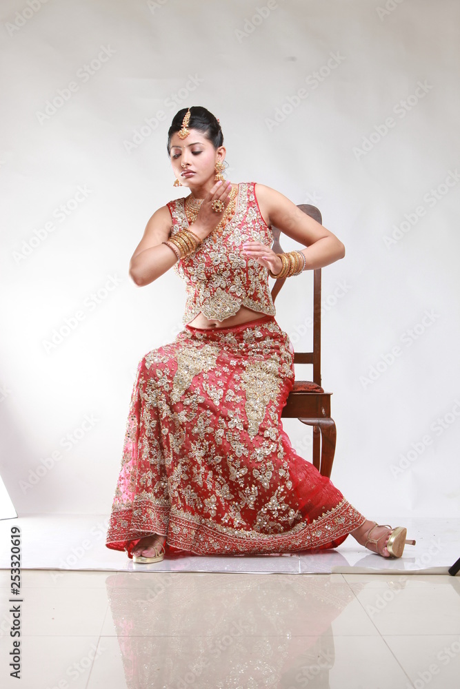 Indian bride in traditional bridal sari in studio lighting indoor Stock ...