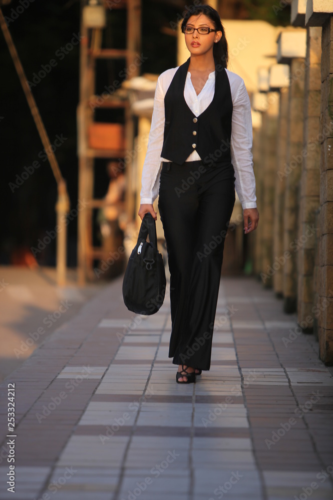 Beautiful business lady in corporate suit posing outdoor wearing ...