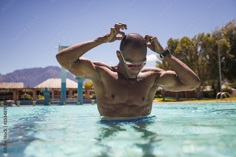 Underwater image of a male swimmer diving and swimming in a swimming ...