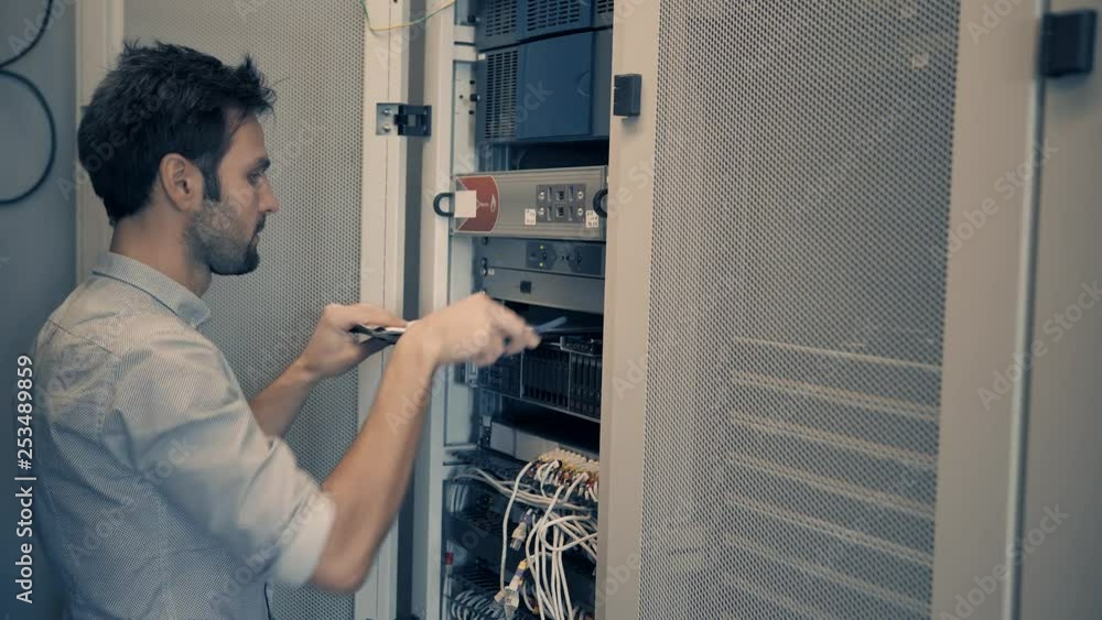 Server IT Engineer In Data Center Server Room.Engineer Working Laptop ...