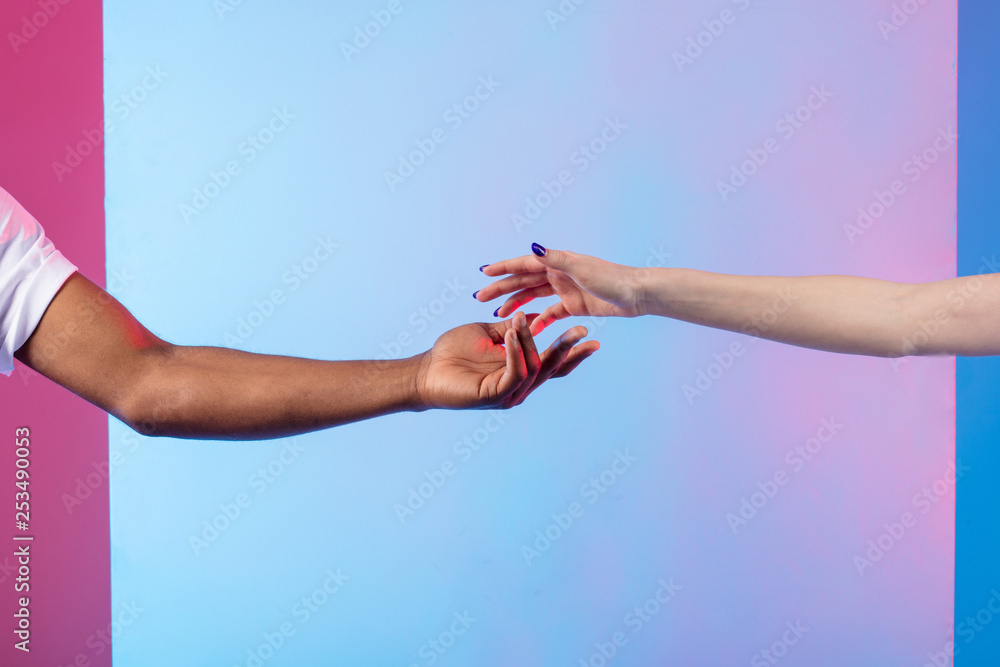 Mixed Race Couple Holding Hands With Each Other Close Up Cropped Photo