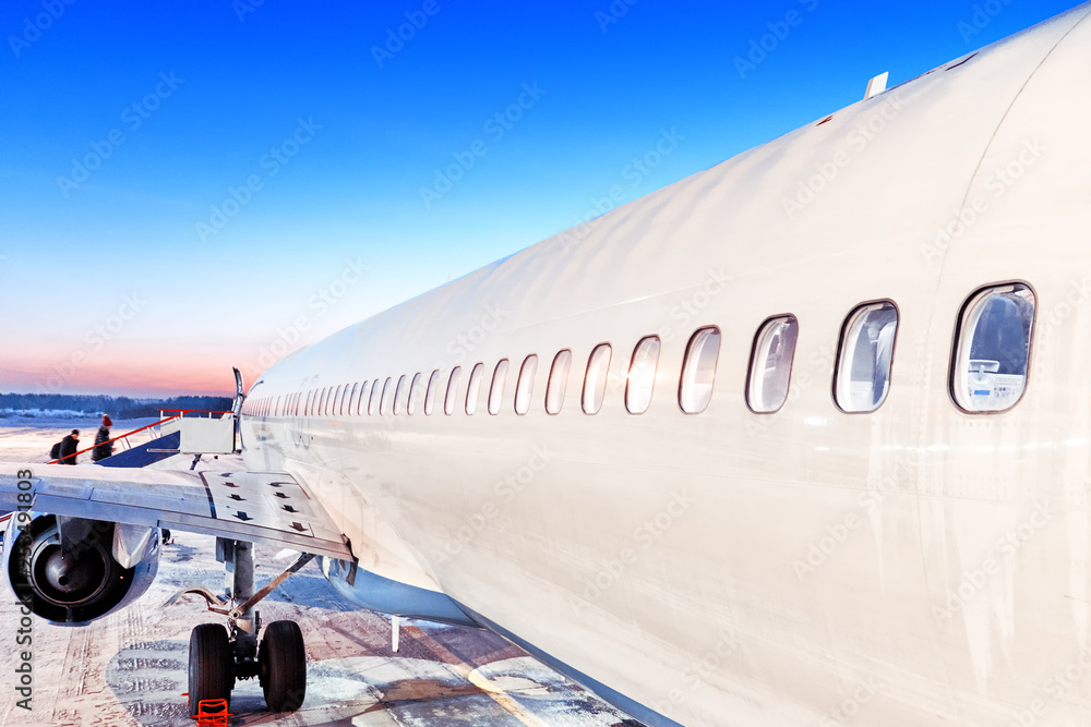 airplane at airport runway passenger boarding with beautiful sunrise ...