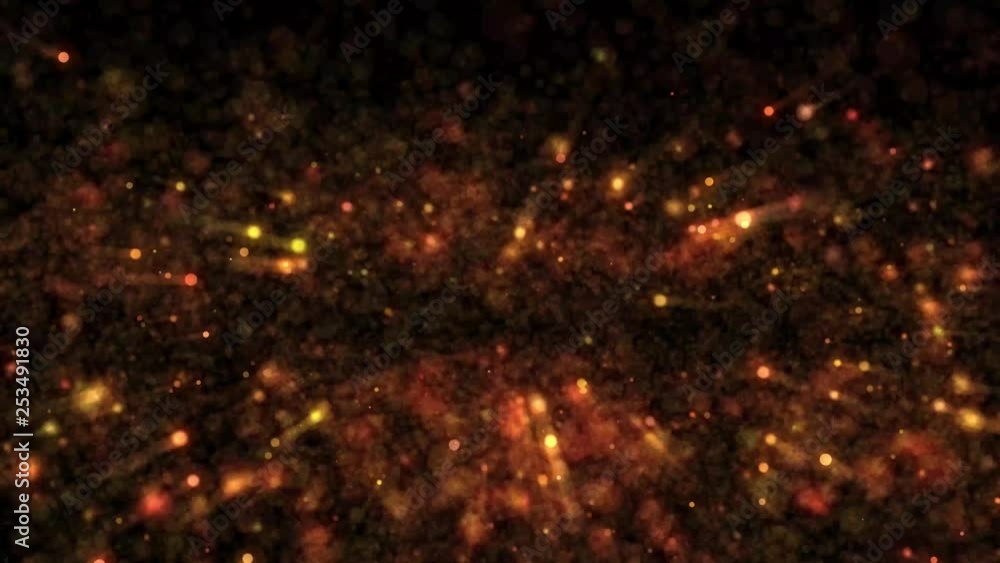 Small Golden particles dance in and out of focus while generating rays ...