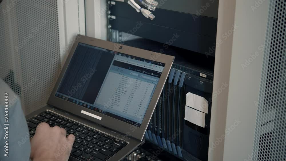 Engineer Working Laptop Computer. Server IT Engineer In Data Center ...