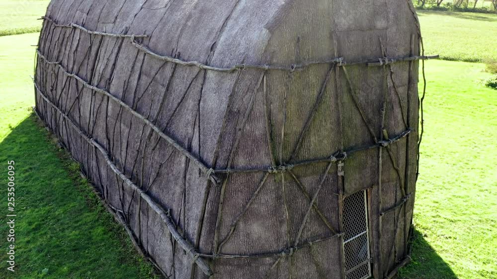 Aerial medium close of side and front of replica Native American ...