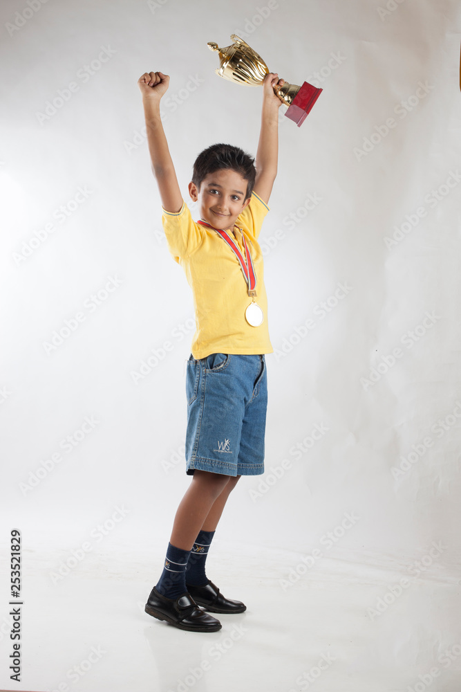 Indian Boy Child Winner Trophy Stock Photo | Adobe Stock