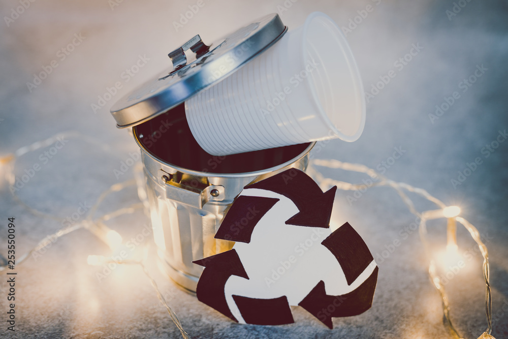 disposable cups and garbage bin with recycle symbol, concept of ...