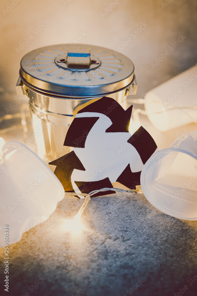 disposable cups and garbage bin with recycle symbol, concept of ...