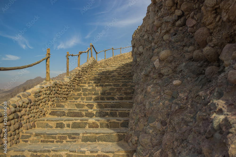 up stairway path way carved in rock stone for climbing step by step on ...